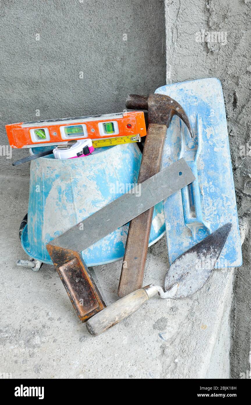 Construction masonry cement mortar tools Stock Photo - Alamy