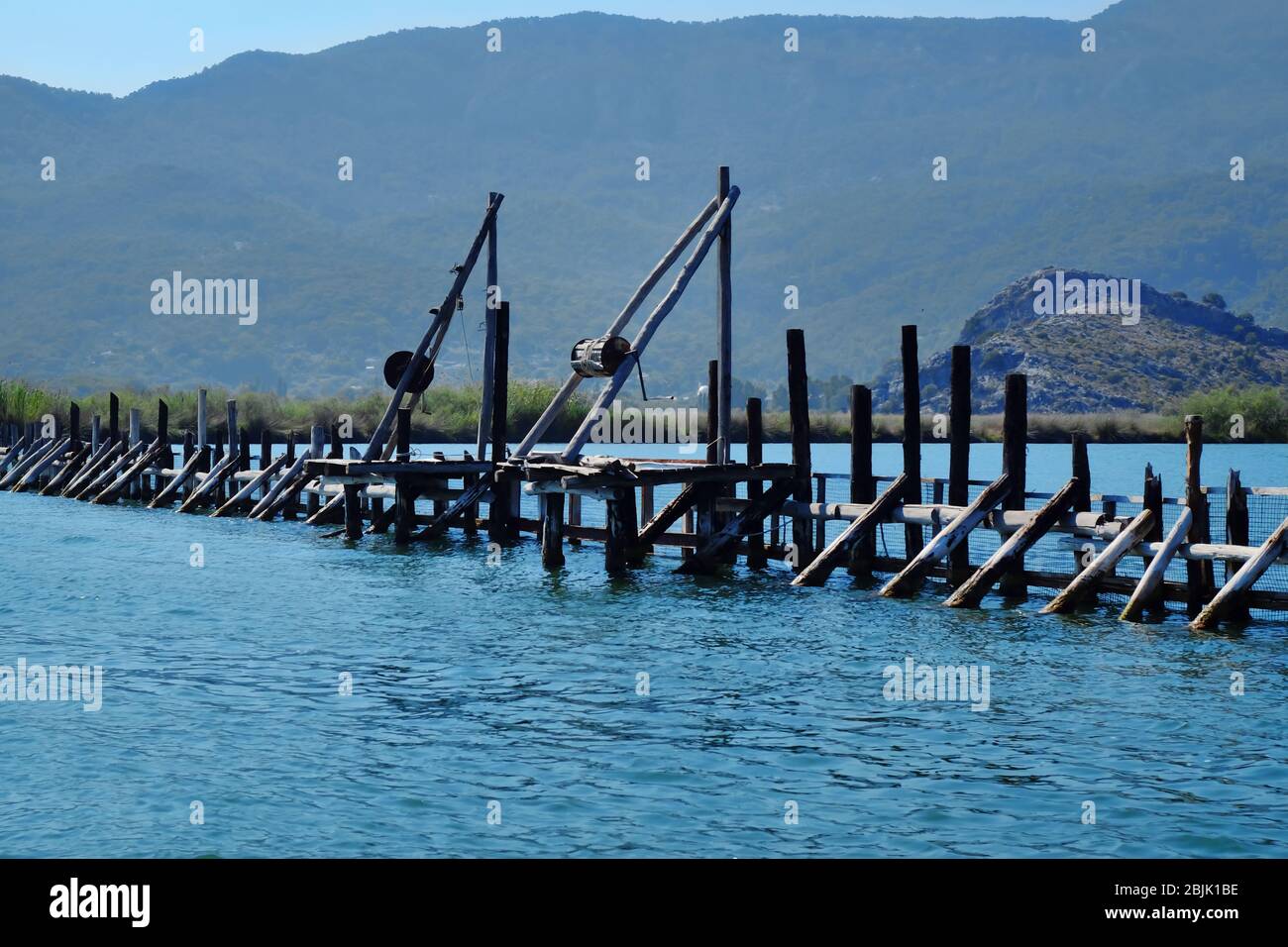 Fencing of fish farm on river Stock Photo - Alamy