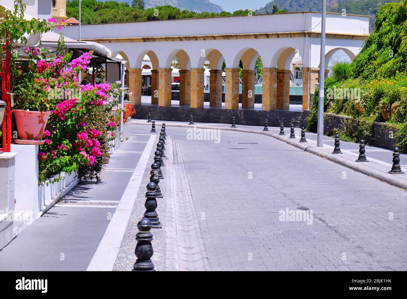 View of road and building with columns Stock Photo - Alamy