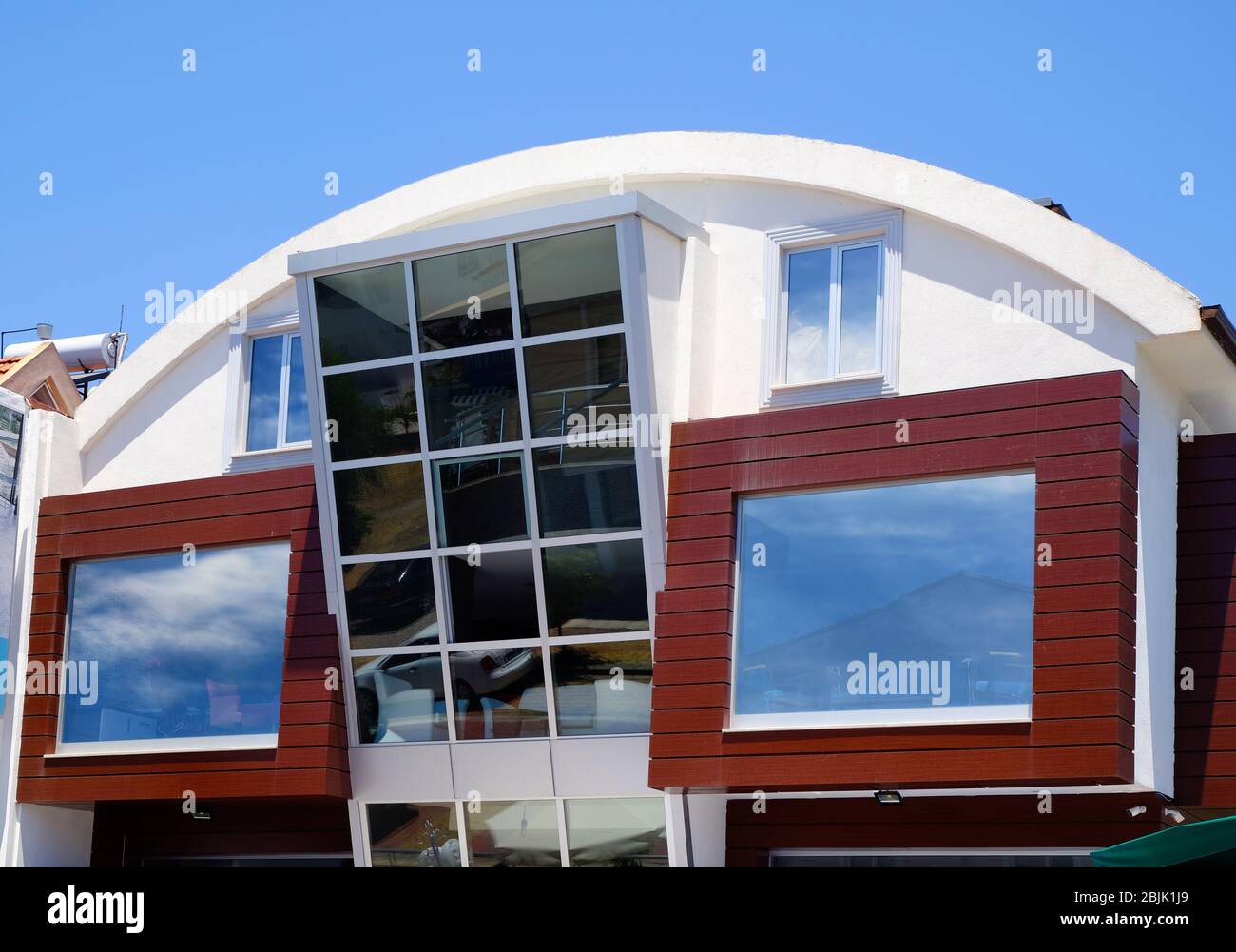 View of modern house with big windows Stock Photo - Alamy