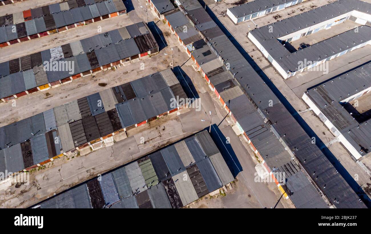 Aerial top down view of many concrete garages for car parking in ...