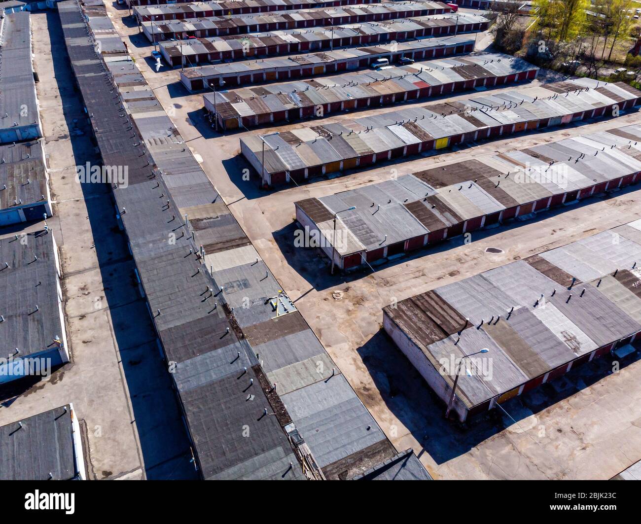 Aerial top down view of many concrete garages for car parking in ...