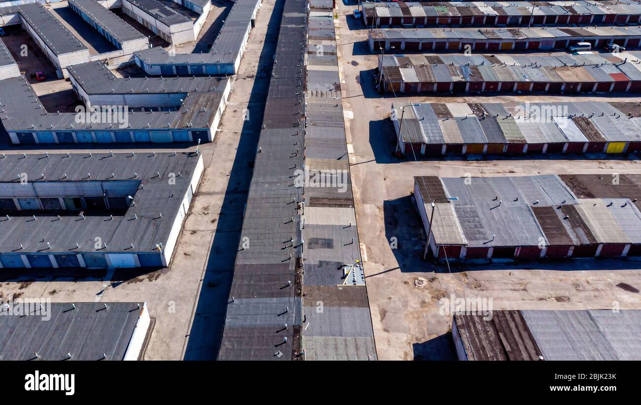 Aerial top down view of many concrete garages for car parking in ...