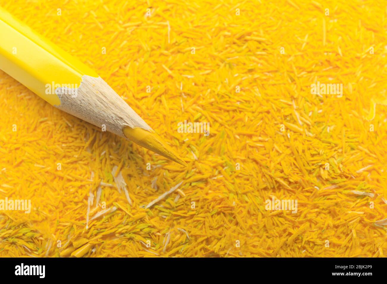 Yellow graphite pencil and shavings, closeup Stock Photo - Alamy