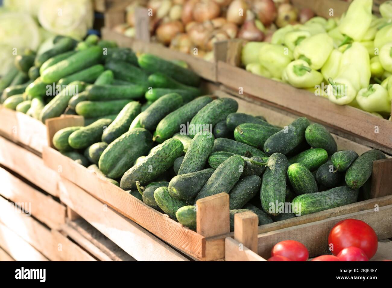 Cucumbers in wooden crate food market hi-res stock photography and ...