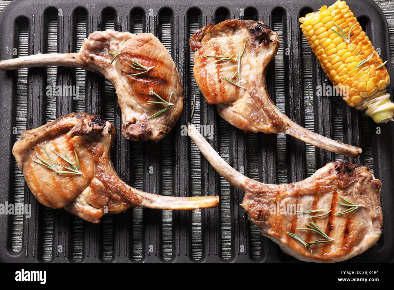 Delicious ribs on grill rack Stock Photo - Alamy