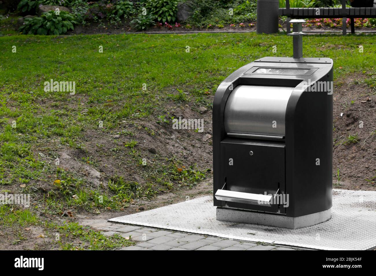 Modern garbage bin outdoors Stock Photo - Alamy