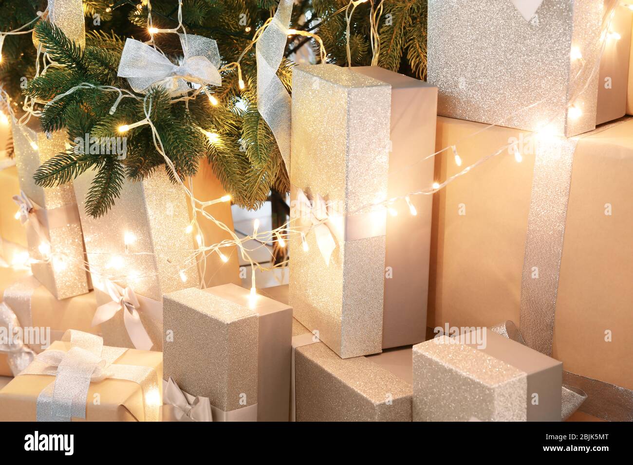 Gift boxes under beautiful decorated Christmas tree, closeup Stock ...