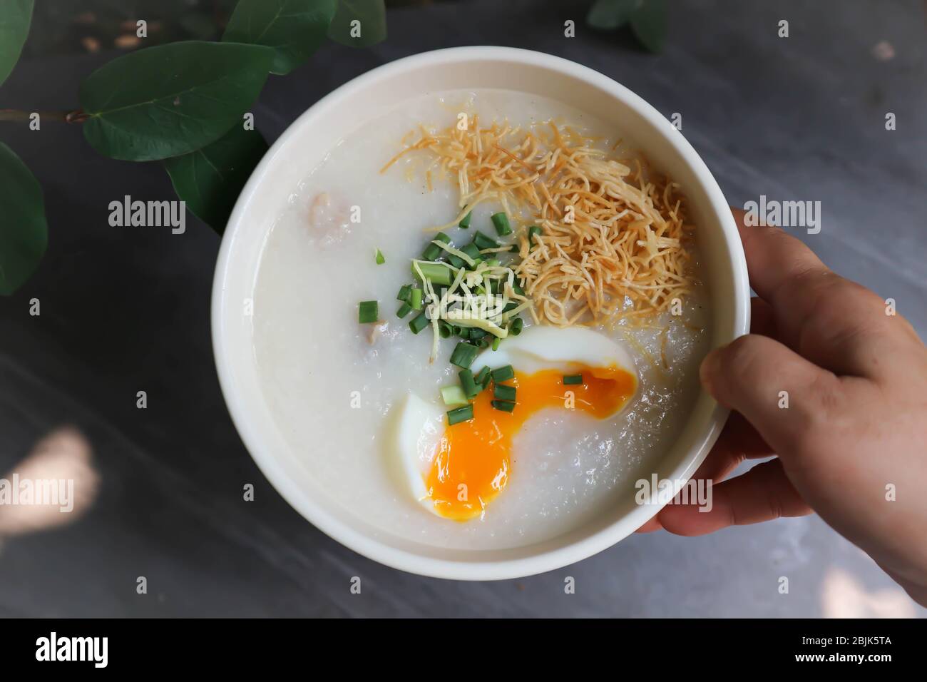 serving rice gruel, rice porridge or congee Stock Photo - Alamy