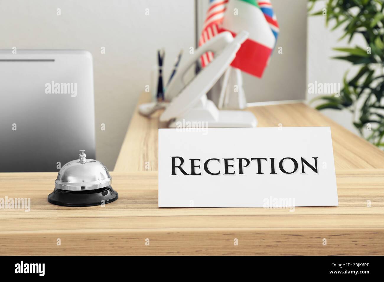 Reception desk with service bell, closeup Stock Photo - Alamy