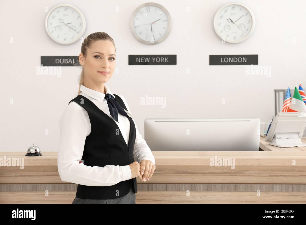 Female hotel receptionist at workplace Stock Photo - Alamy