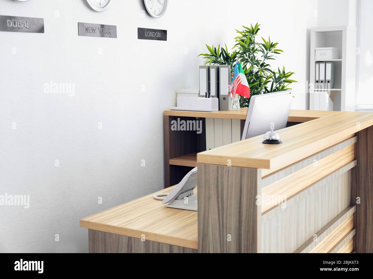 Reception desk in hotel Stock Photo - Alamy