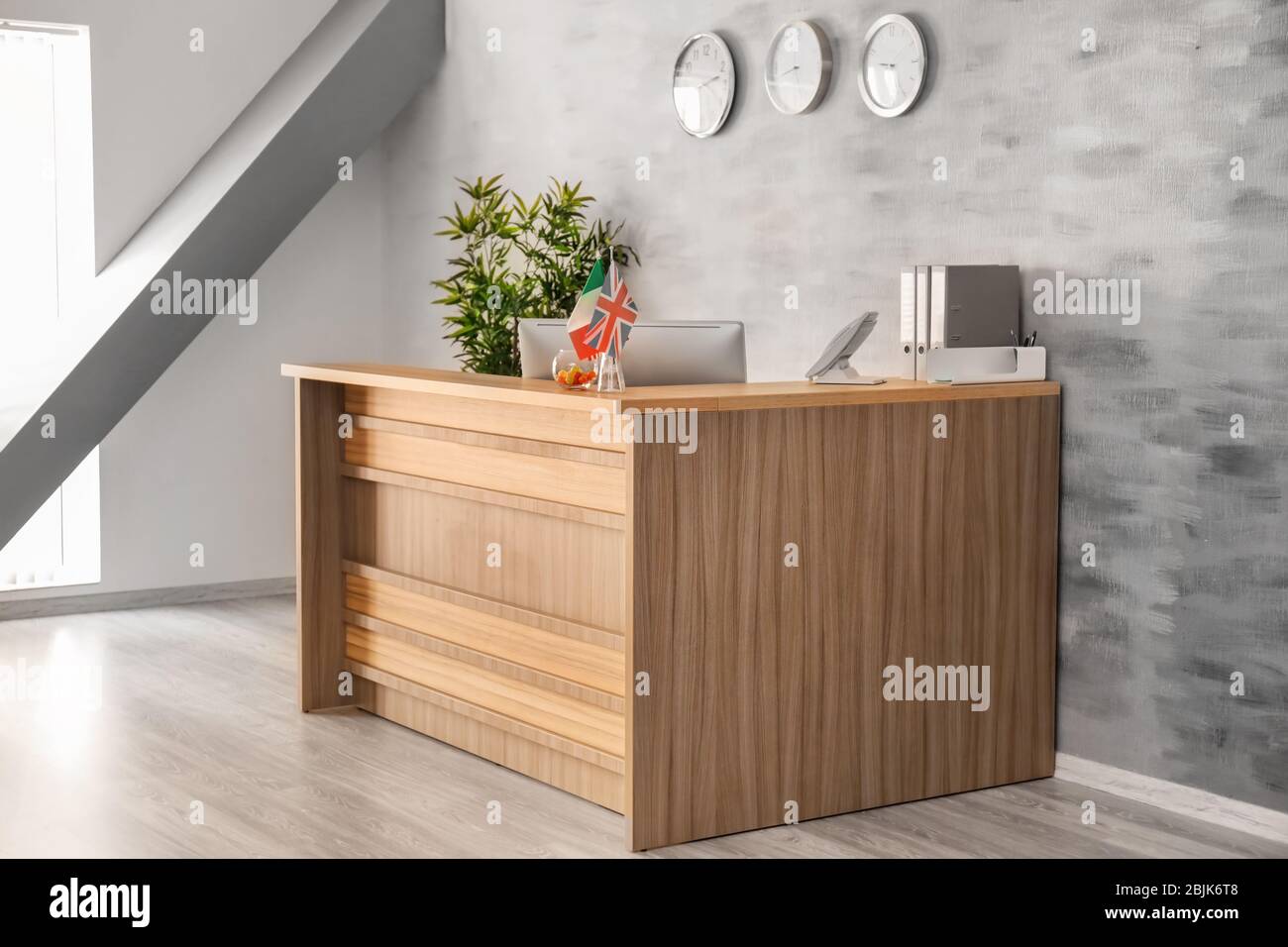Reception desk in hotel Stock Photo - Alamy