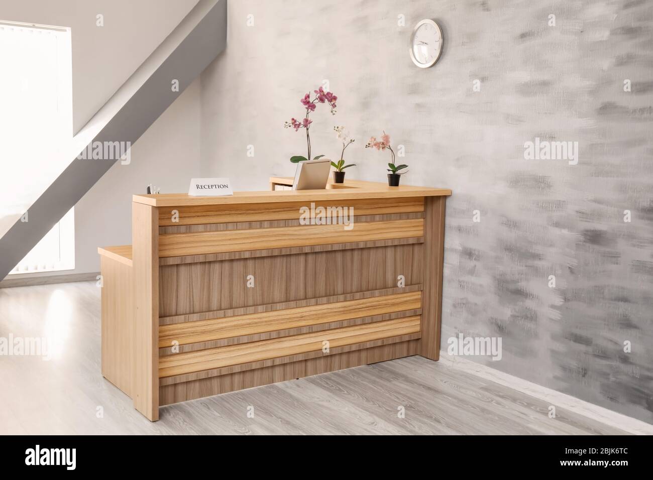 Reception desk in hotel Stock Photo - Alamy