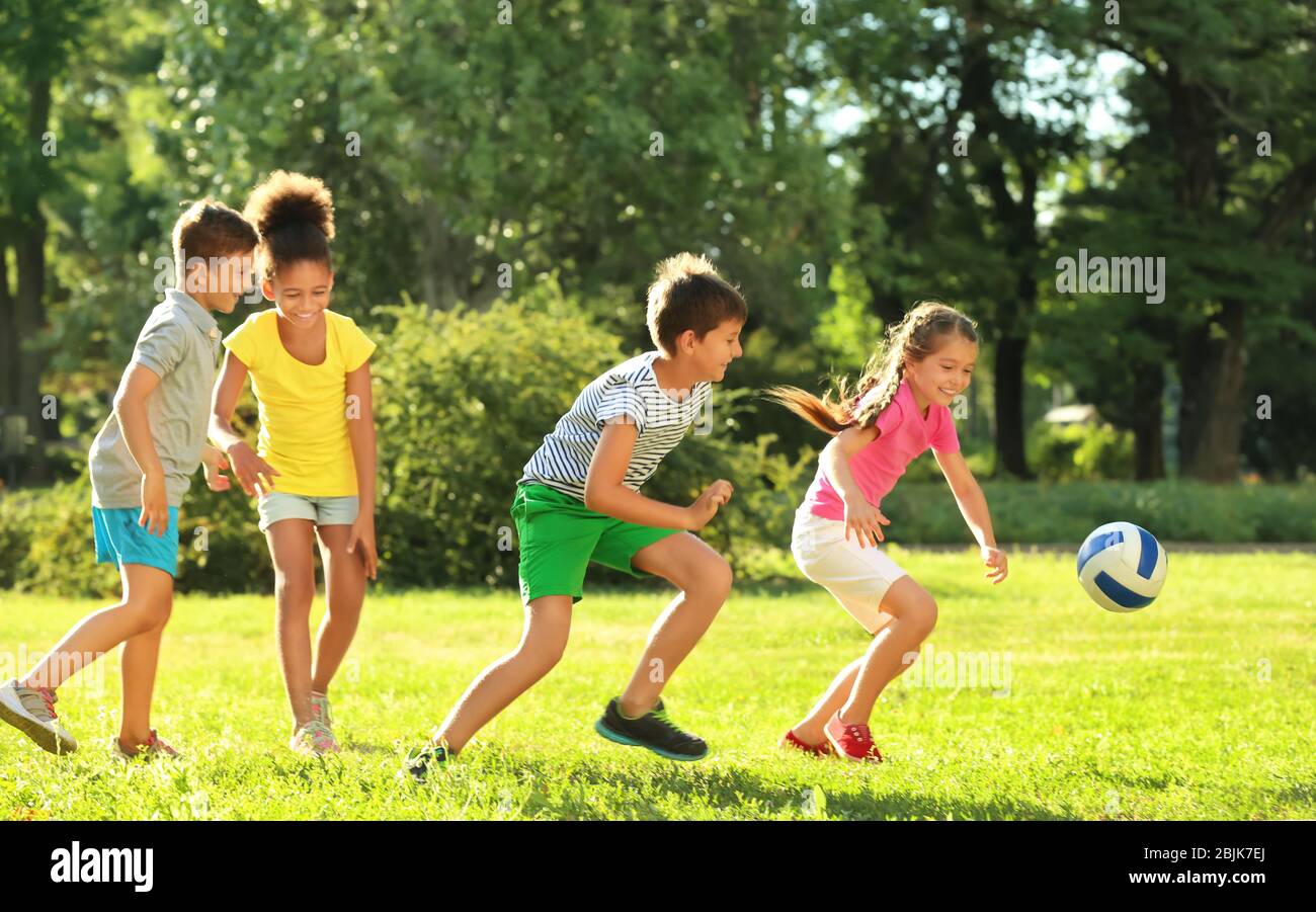 Cute children playing with ball in park Stock Photo - Alamy