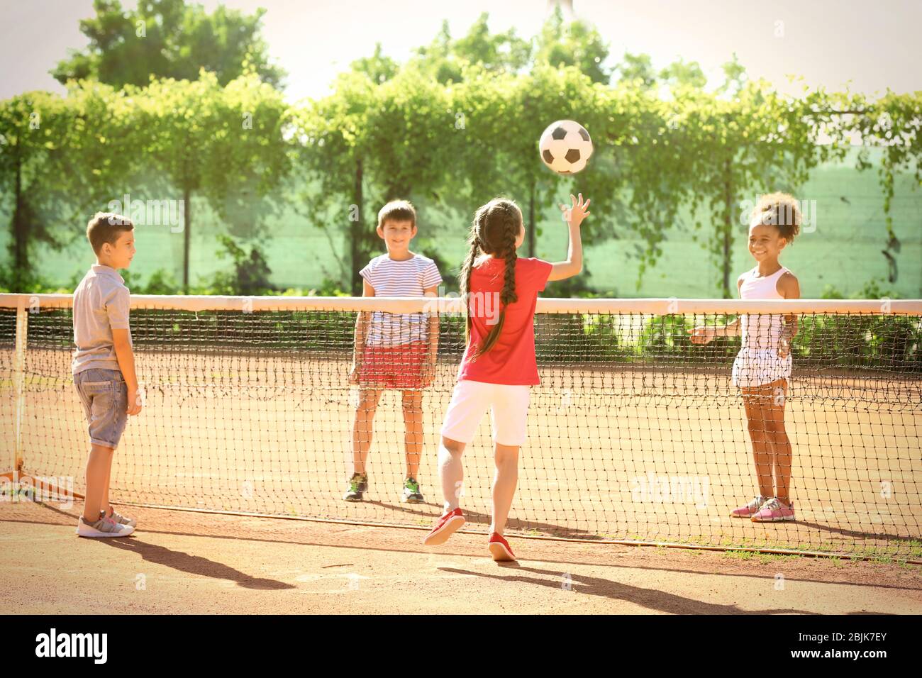 Cute children playing on sports ground outdoors Stock Photo - Alamy
