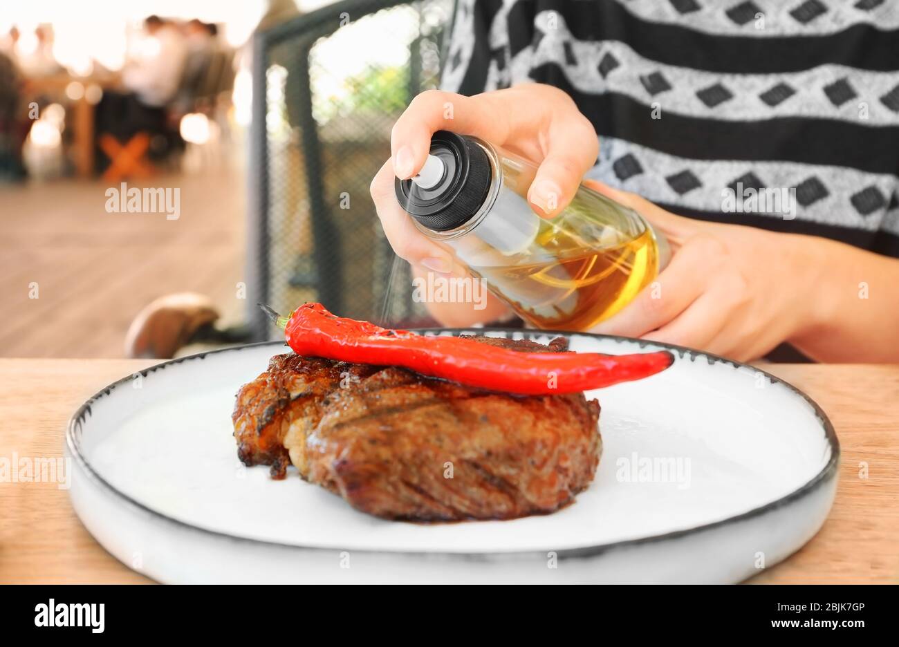 Woman adding oil hi-res stock photography and images - Alamy