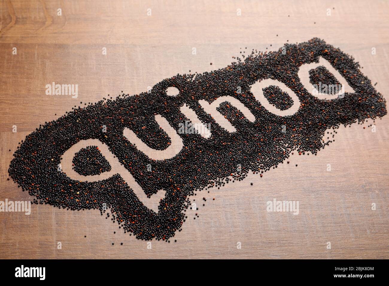 Word QUINOA written on scattered seeds Stock Photo - Alamy
