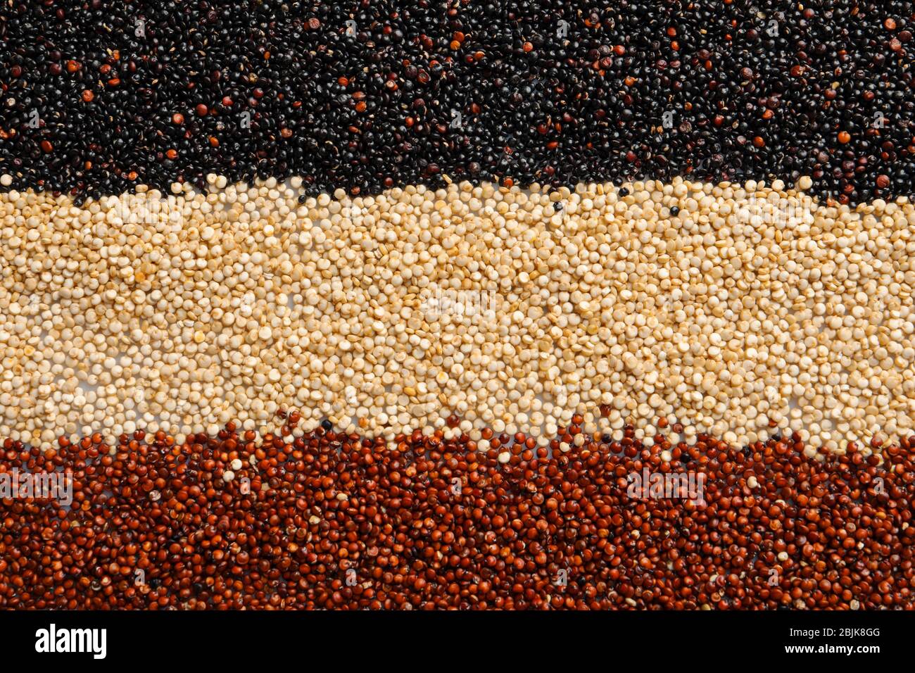 Different raw quinoa seeds as background Stock Photo - Alamy
