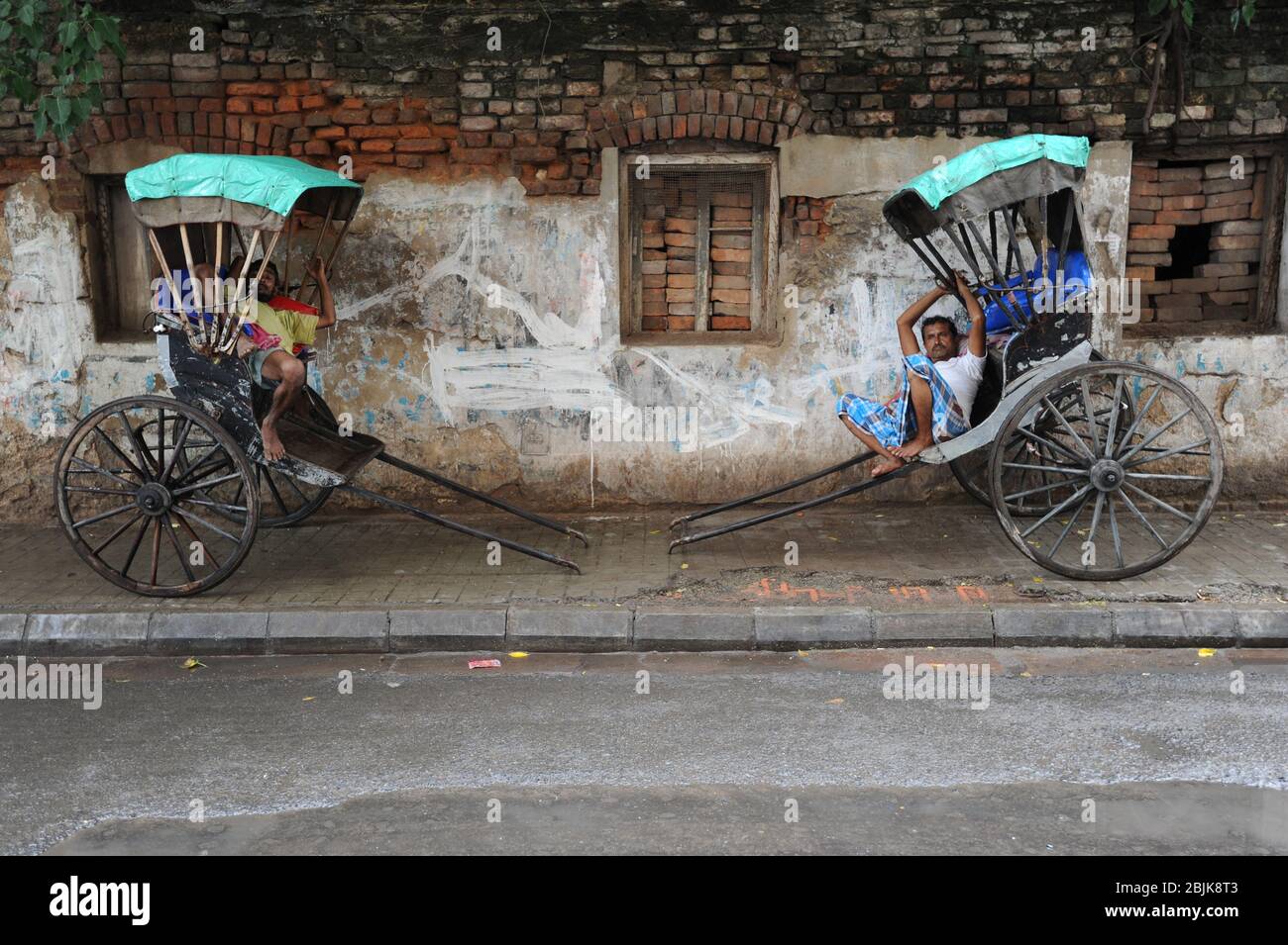 Hand pulled rickshaw calcutta street scene calcutta india hi-res stock ...