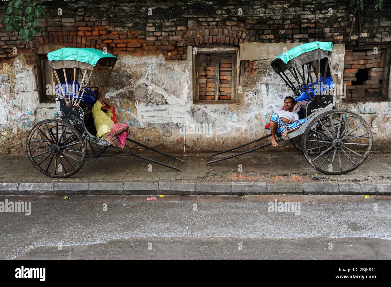 Hand rickshaw puller rest hi-res stock photography and images - Alamy