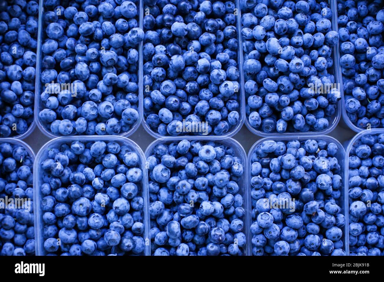 Delicious blueberries in plastic containers Stock Photo - Alamy