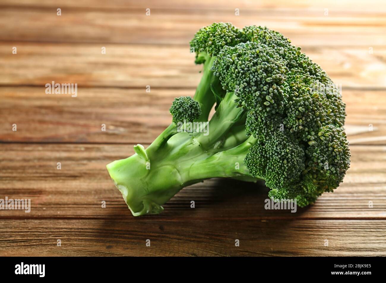 Fresh broccoli on wooden table Stock Photo - Alamy