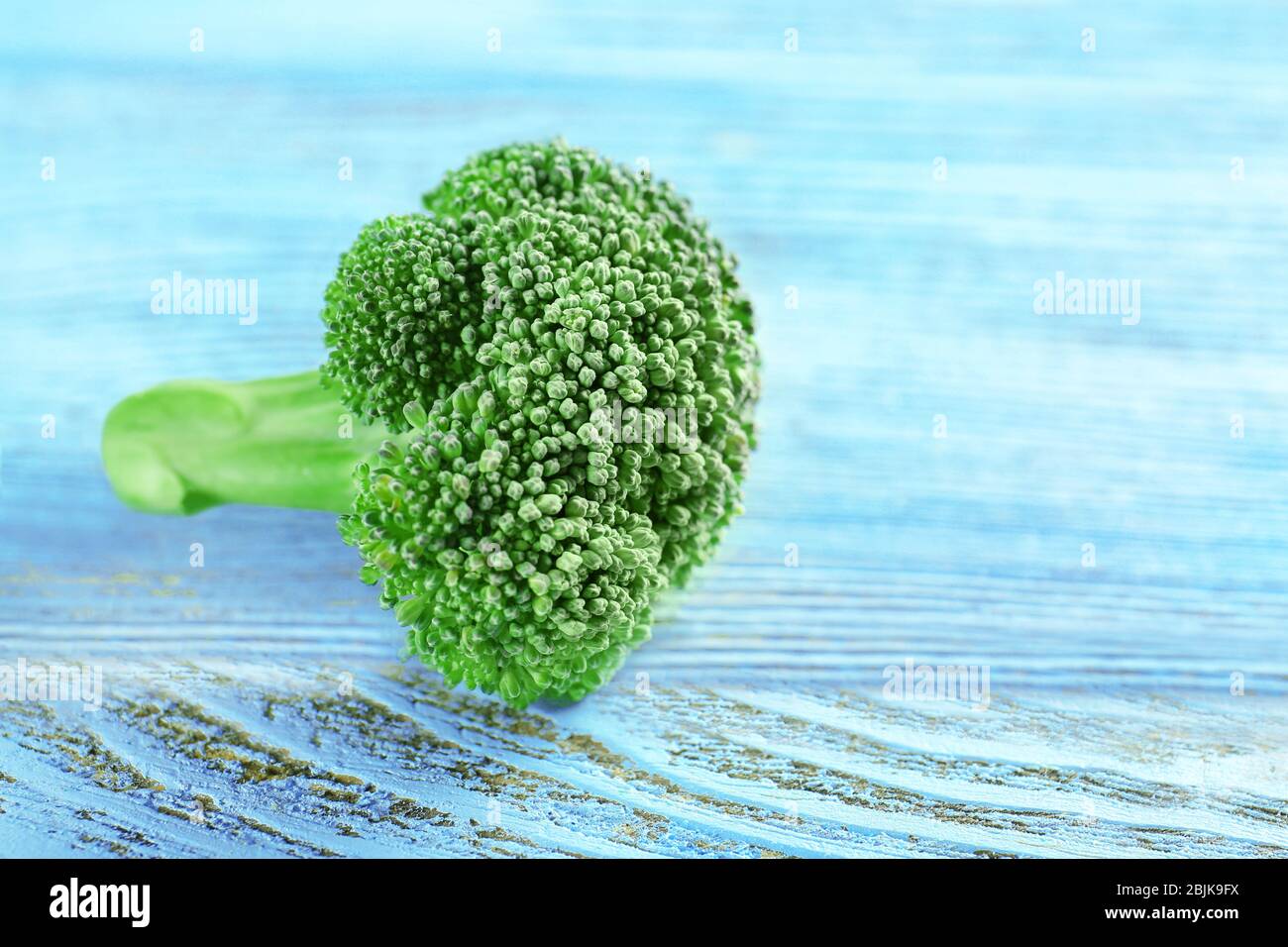 Fresh broccoli on wooden table Stock Photo - Alamy