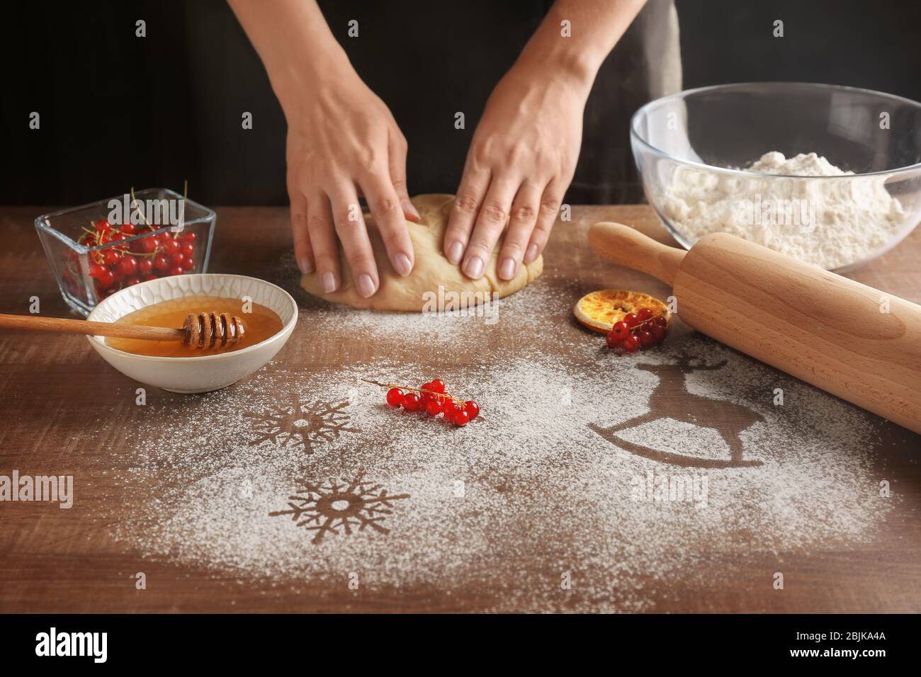 Young woman making gingerbread hi-res stock photography and images - Alamy