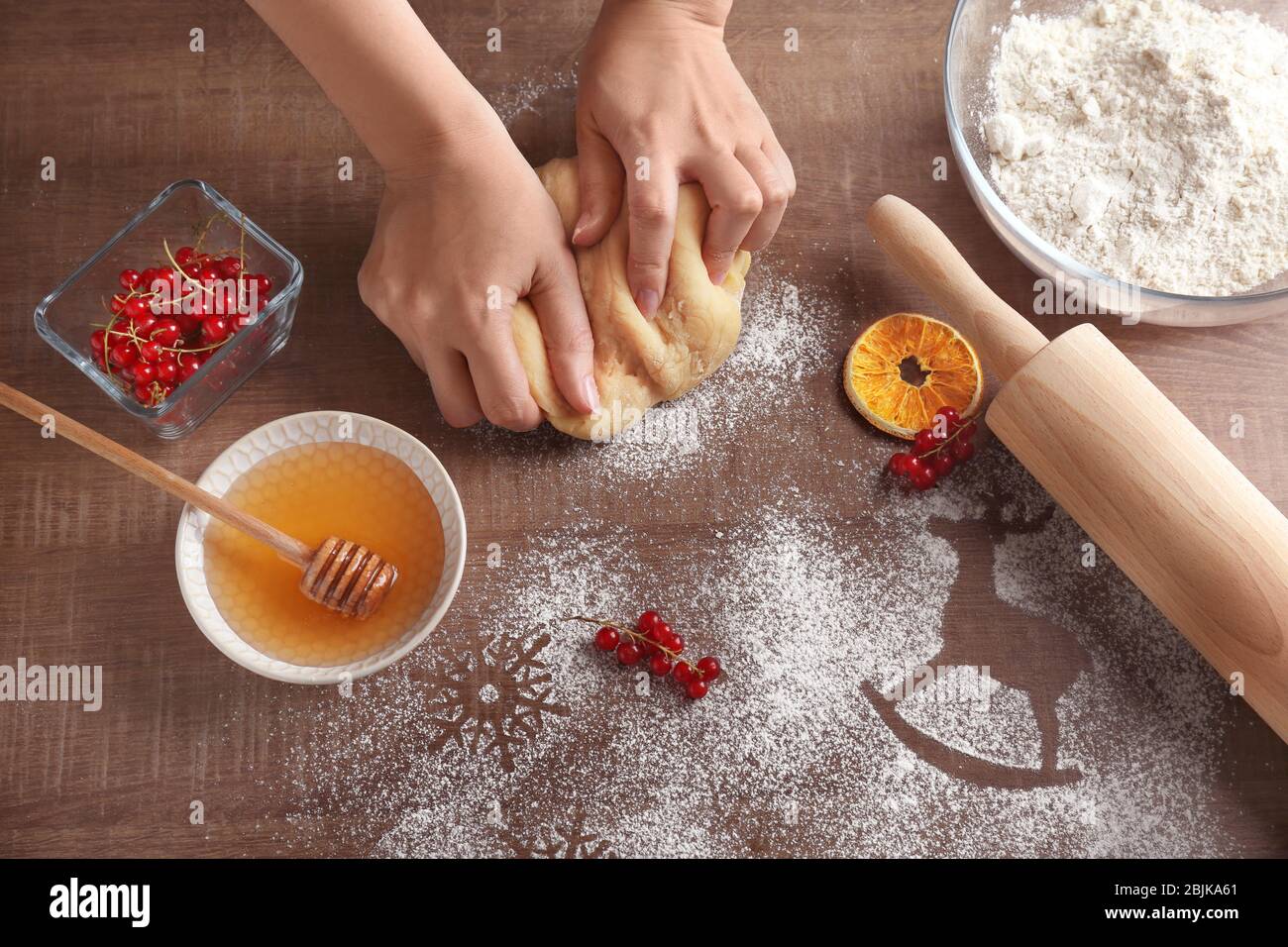 Young woman making gingerbread hi-res stock photography and images - Alamy