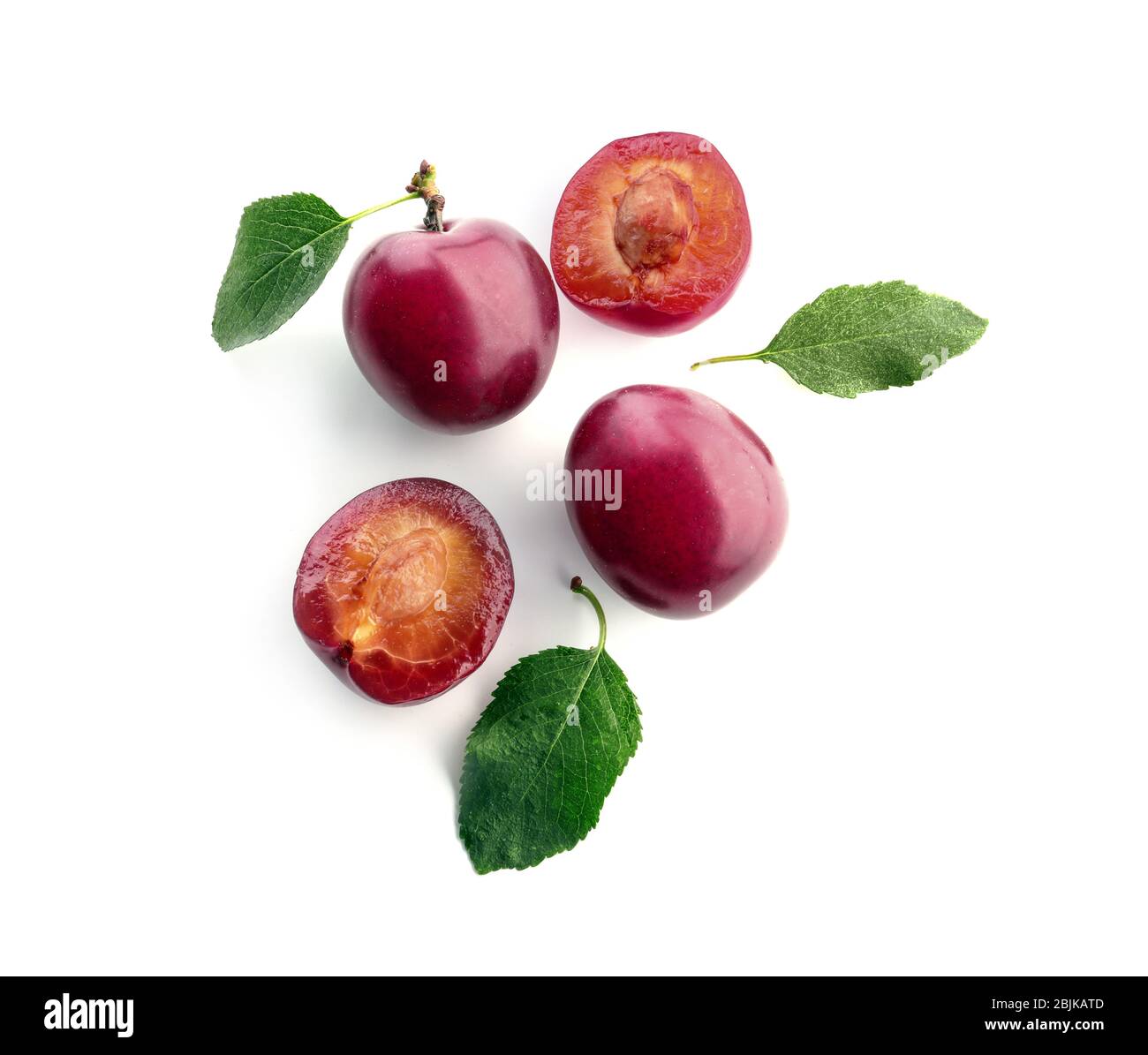 Ripe fresh plums on white background Stock Photo - Alamy