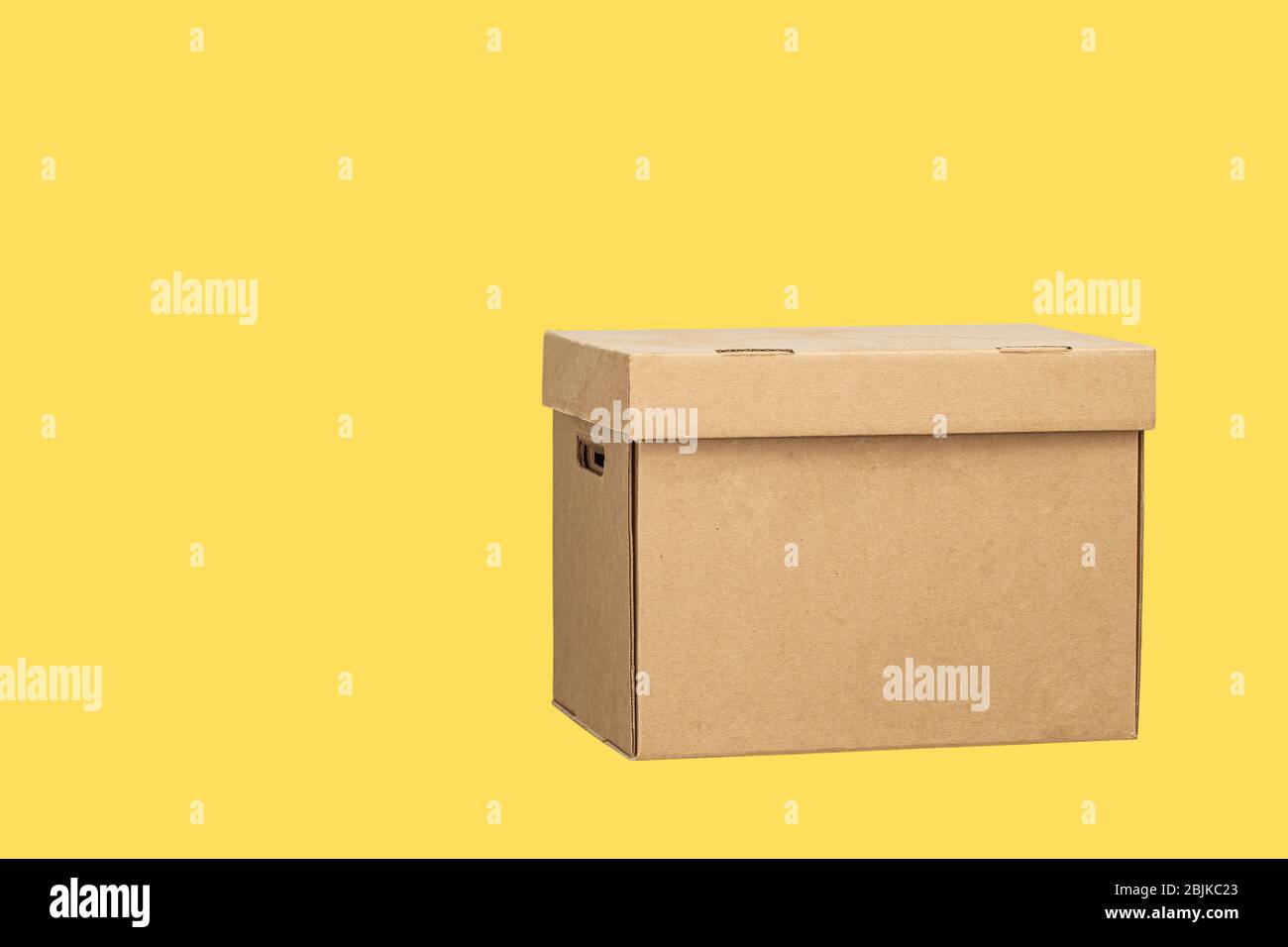 Cardboard box isolated on a yellow background. Carton Packaging Box ...