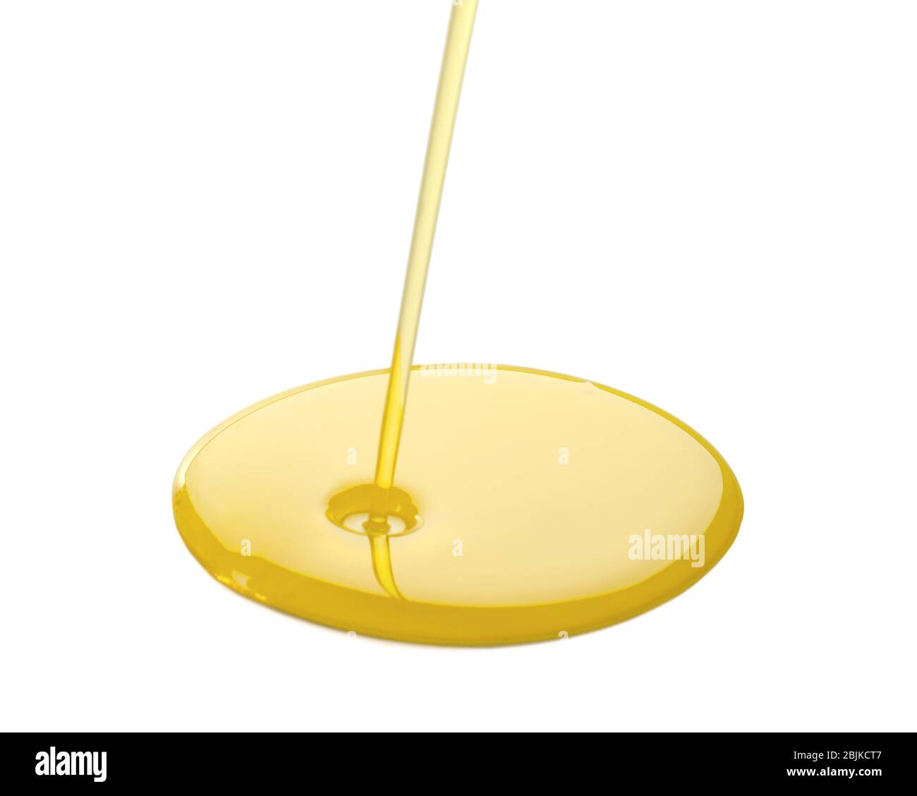 Spilling cooking oil on white background Stock Photo - Alamy