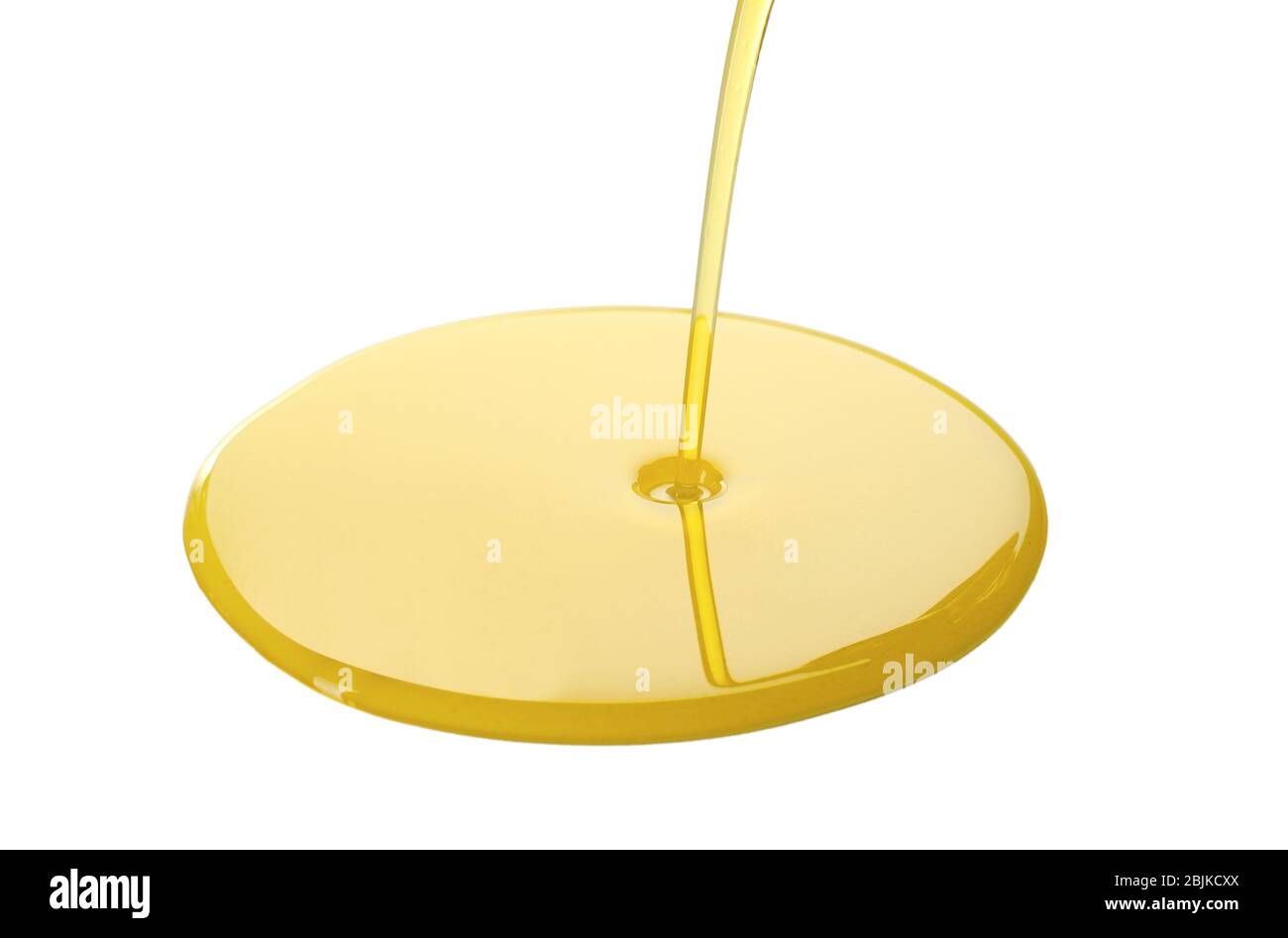 Spilling cooking oil on white background Stock Photo - Alamy