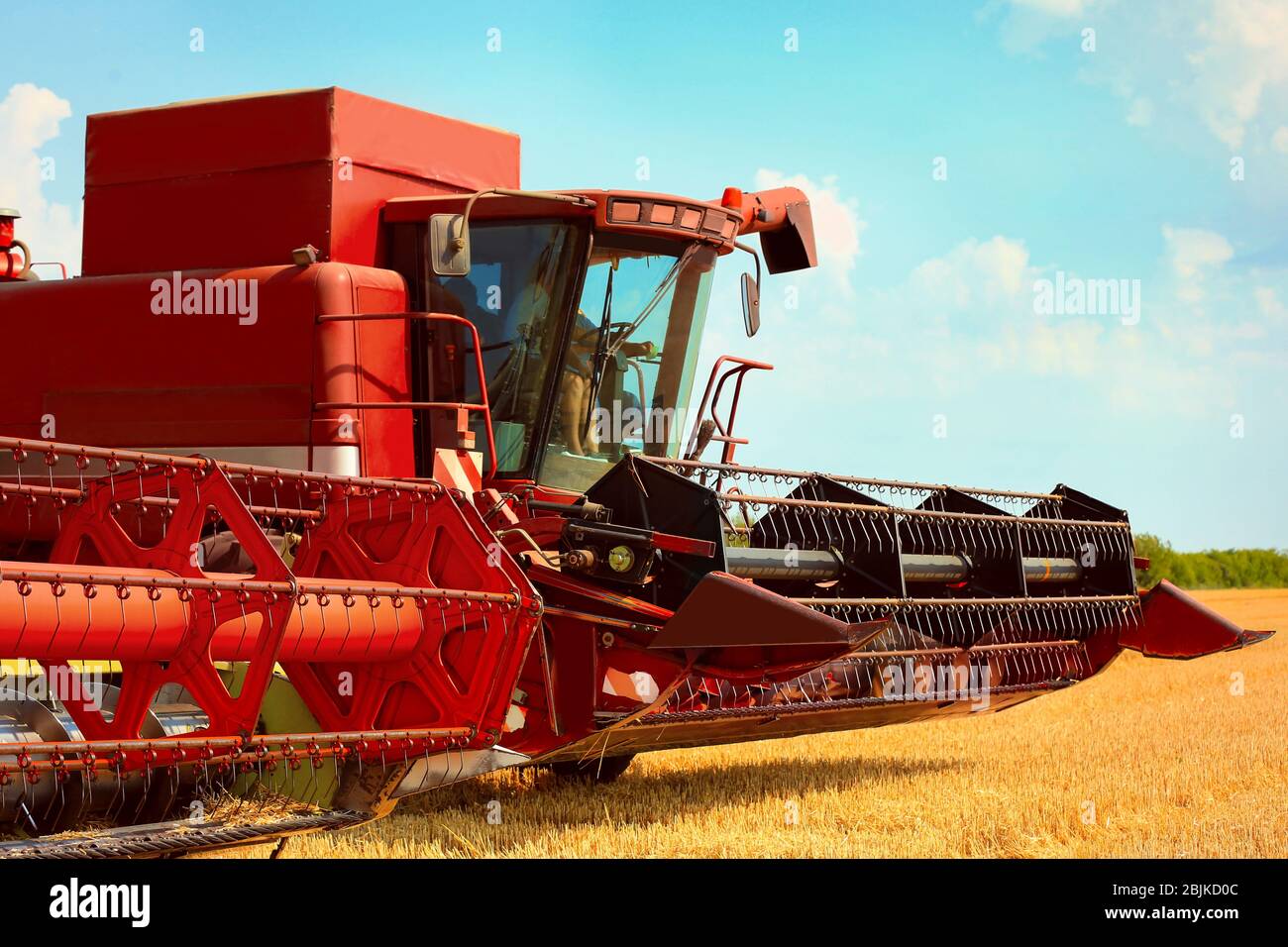 Combine harvester in field Stock Photo - Alamy