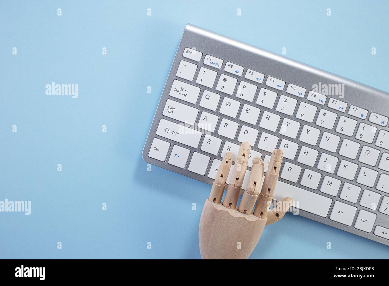 Keyboard of laptop on blue background, minimal style. Workspace with a ...