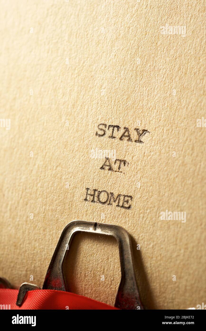 Stay at home text written on a paper Stock Photo - Alamy