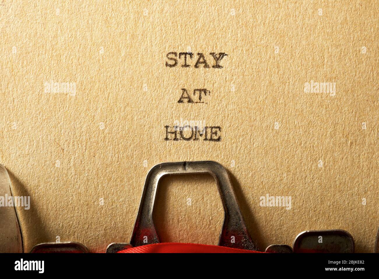 Stay at home text written on a paper Stock Photo - Alamy