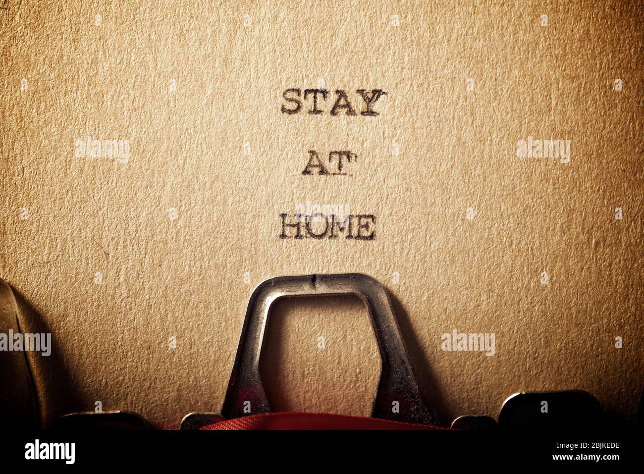 Stay at home text written on a paper Stock Photo - Alamy
