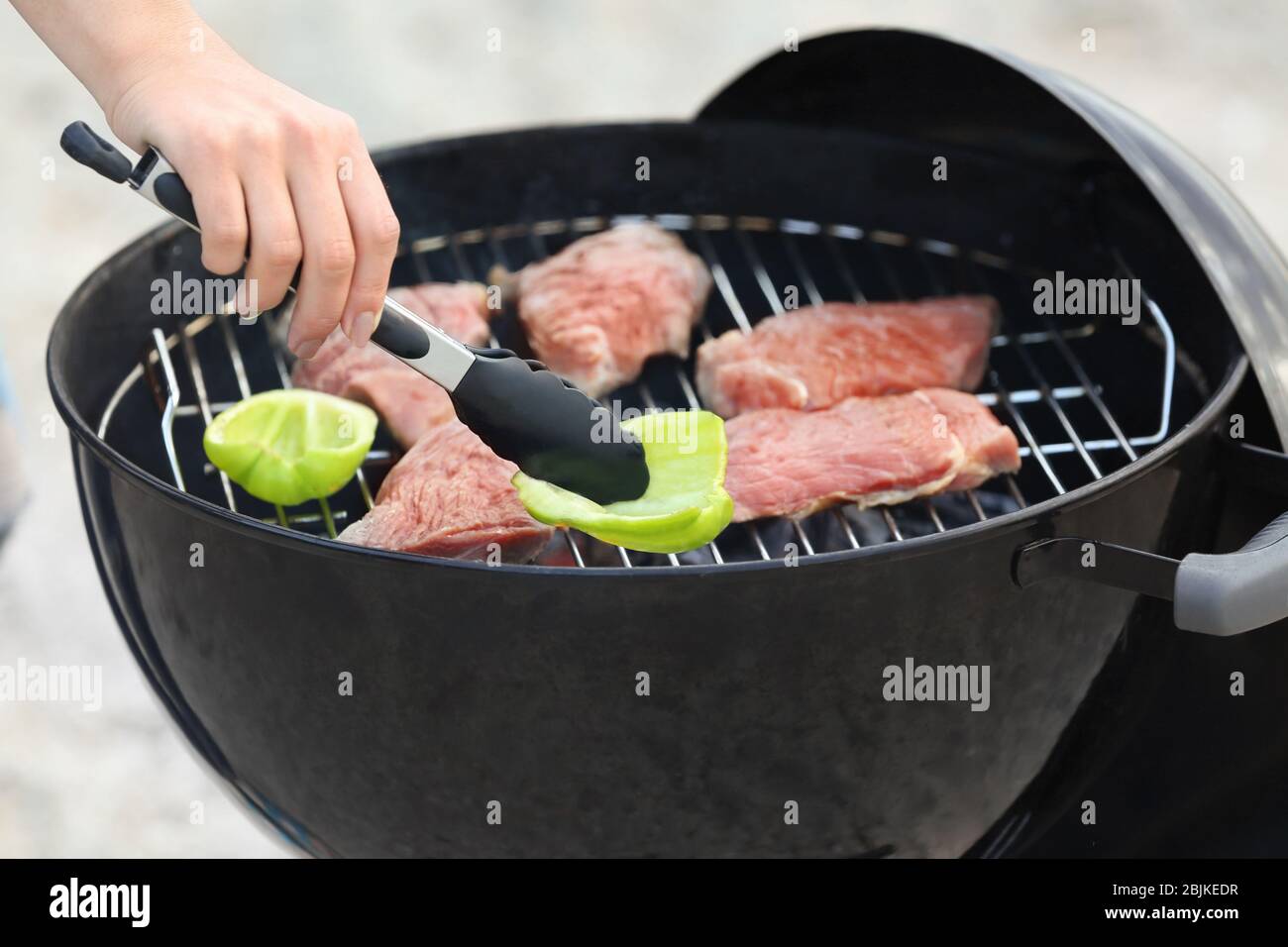 Barbecue grill steaks woman hi-res stock photography and images - Alamy