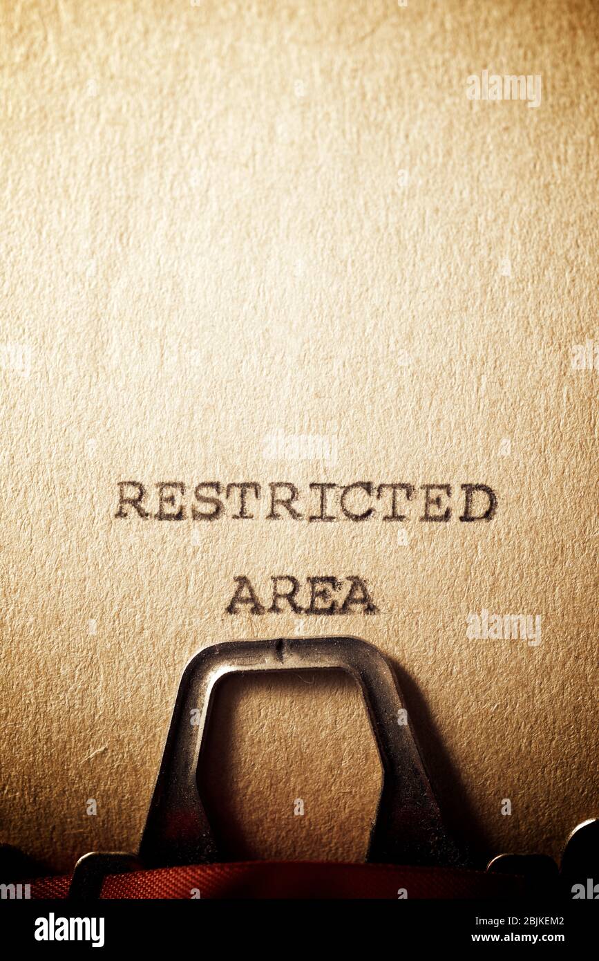 Restricted area text written on a paper Stock Photo - Alamy