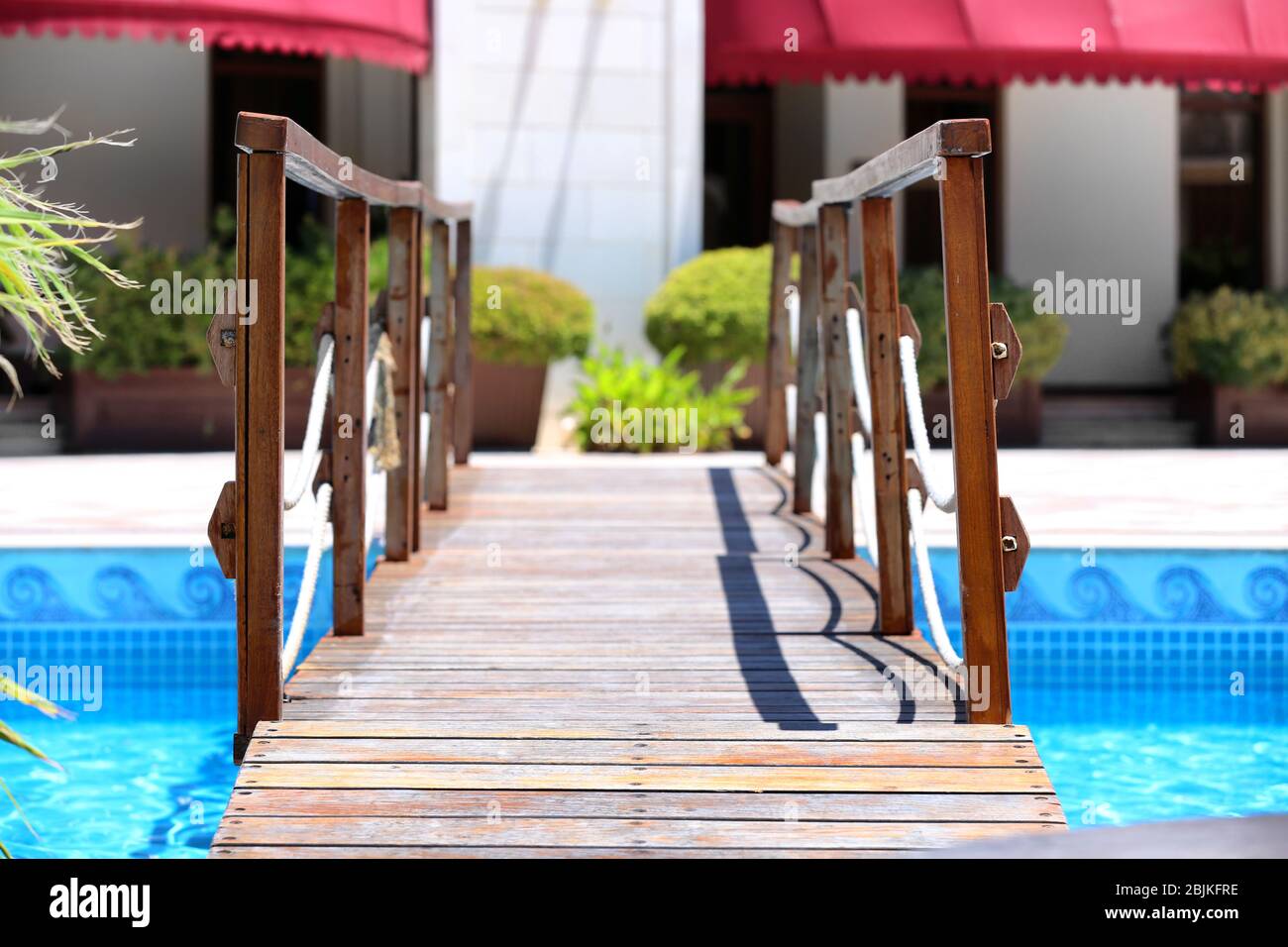 Wooden bridge over swimming pool hi-res stock photography and images ...