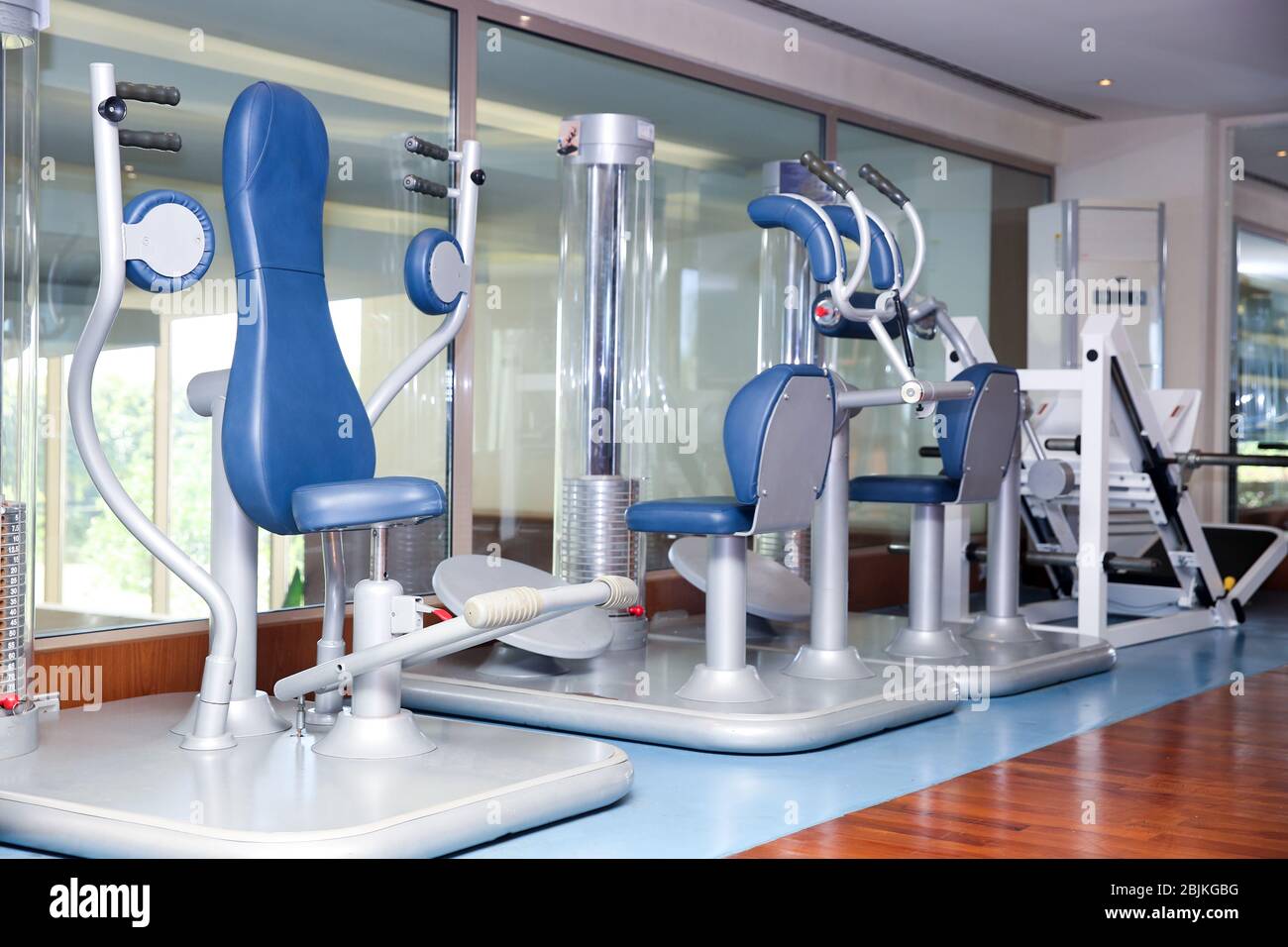Interior of modern gym with machines Stock Photo - Alamy