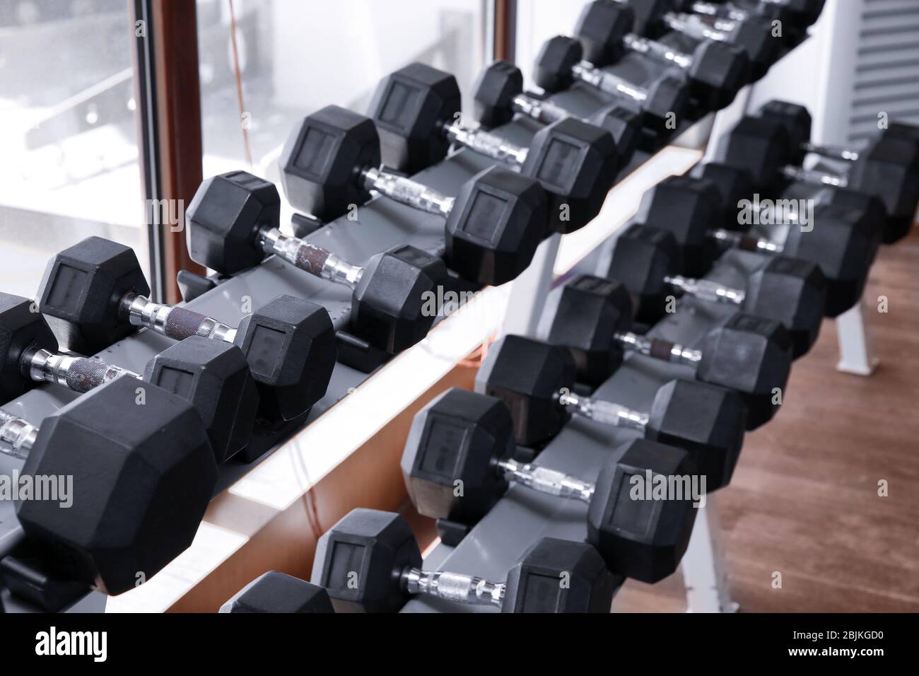 Set of dumbbells in gym Stock Photo - Alamy