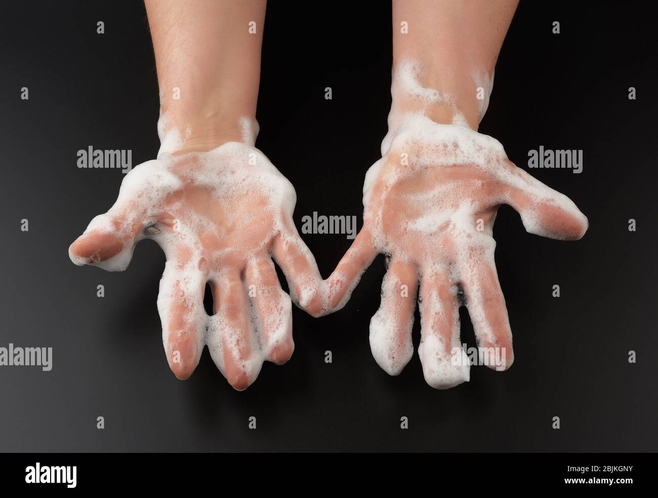 Hand in washing up with soap suds hi-res stock photography and images ...