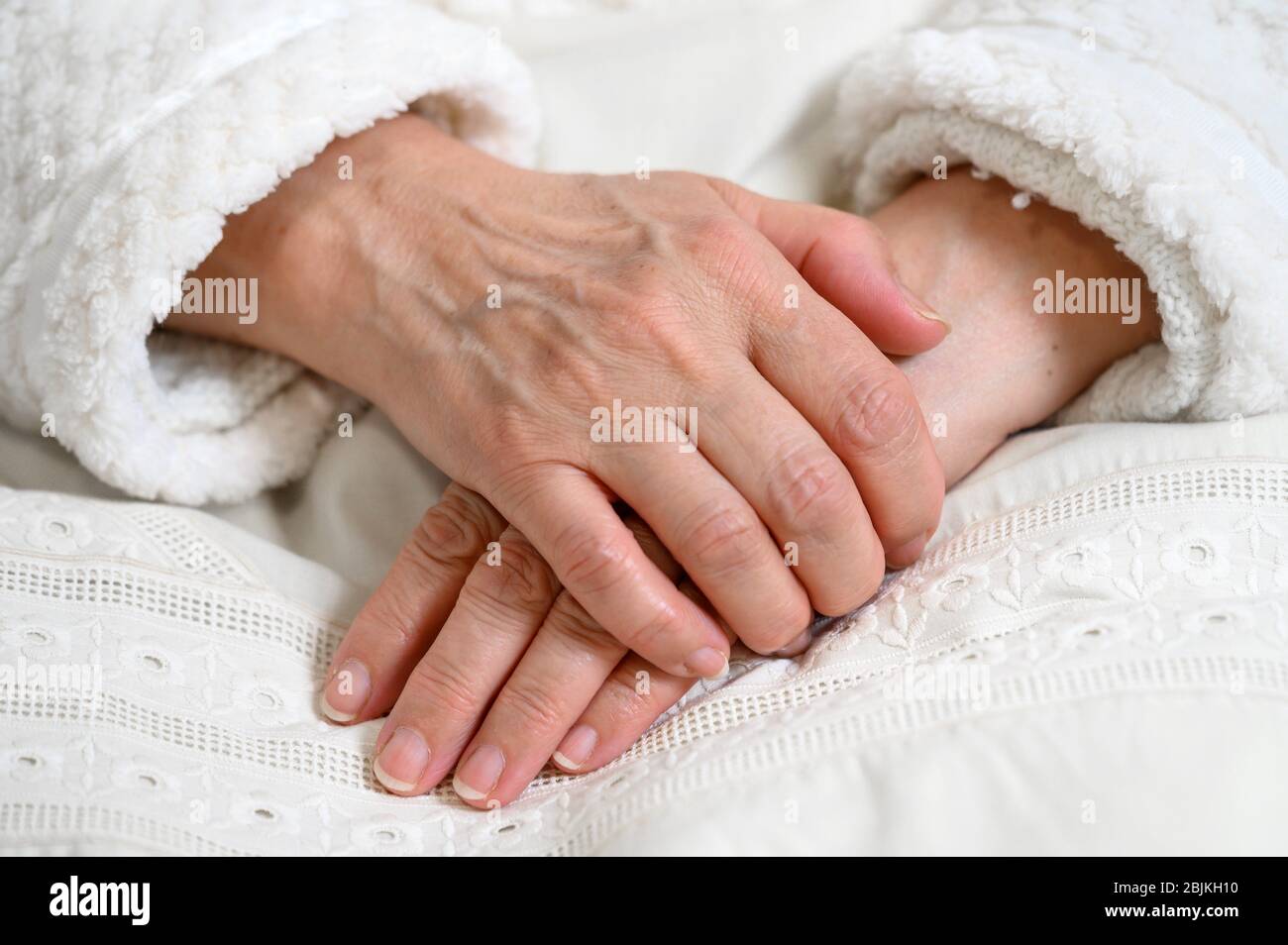Elderly clasped hands hi-res stock photography and images - Alamy