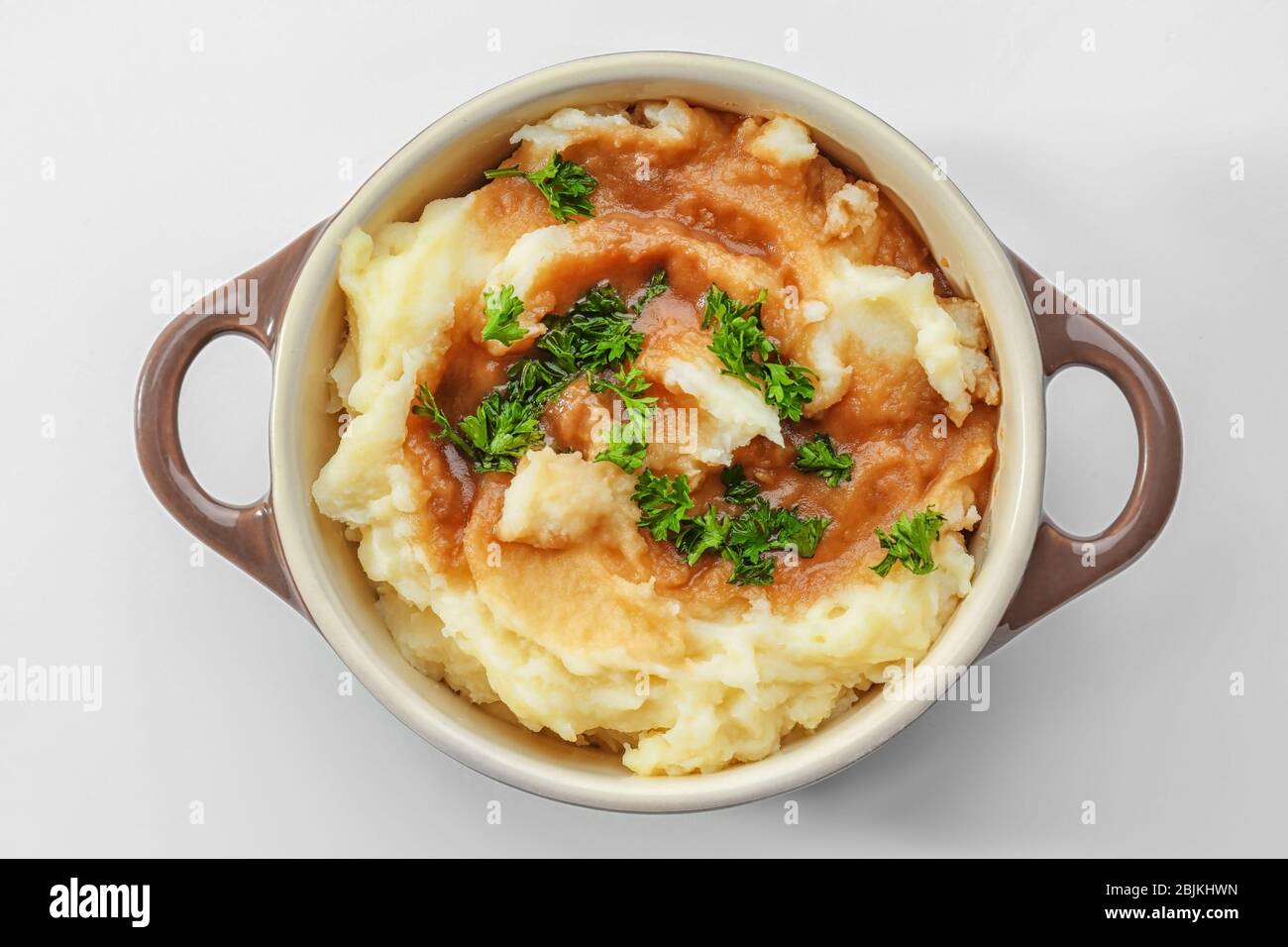 Mashed potatoes in pot, isolated on white Stock Photo - Alamy