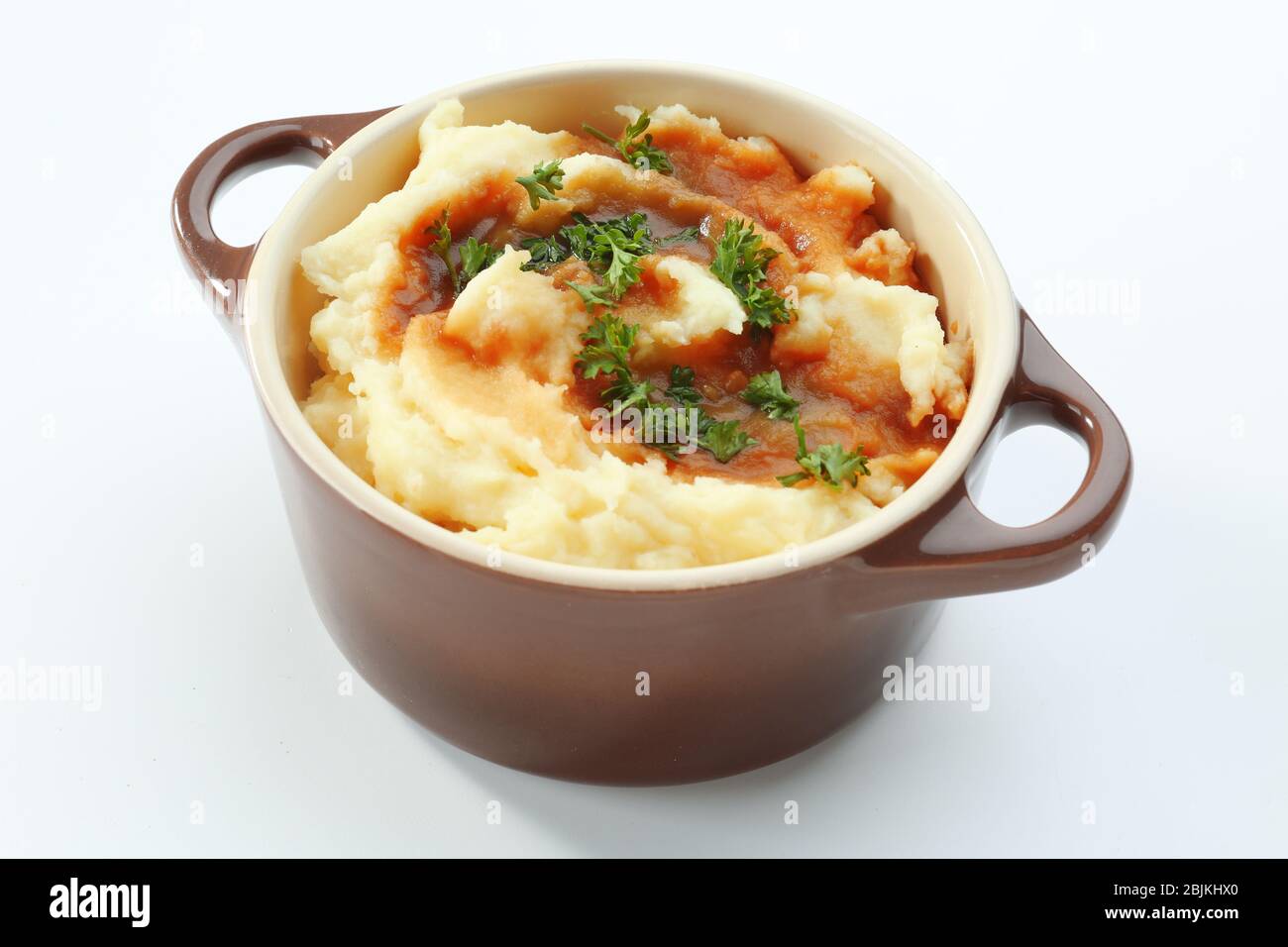 Mashed potatoes in pot, isolated on white Stock Photo - Alamy