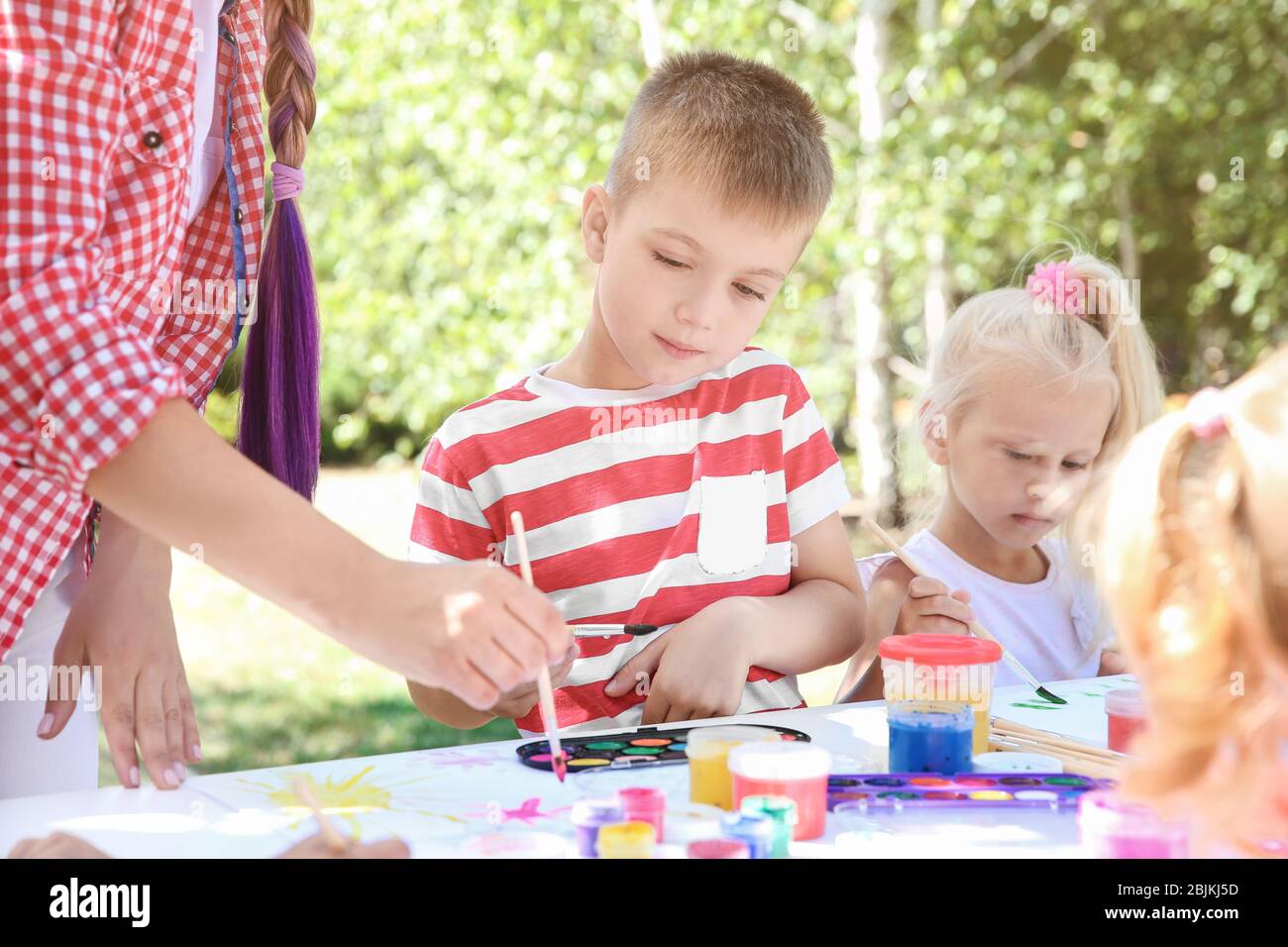 Children at painting lesson outdoors Stock Photo - Alamy
