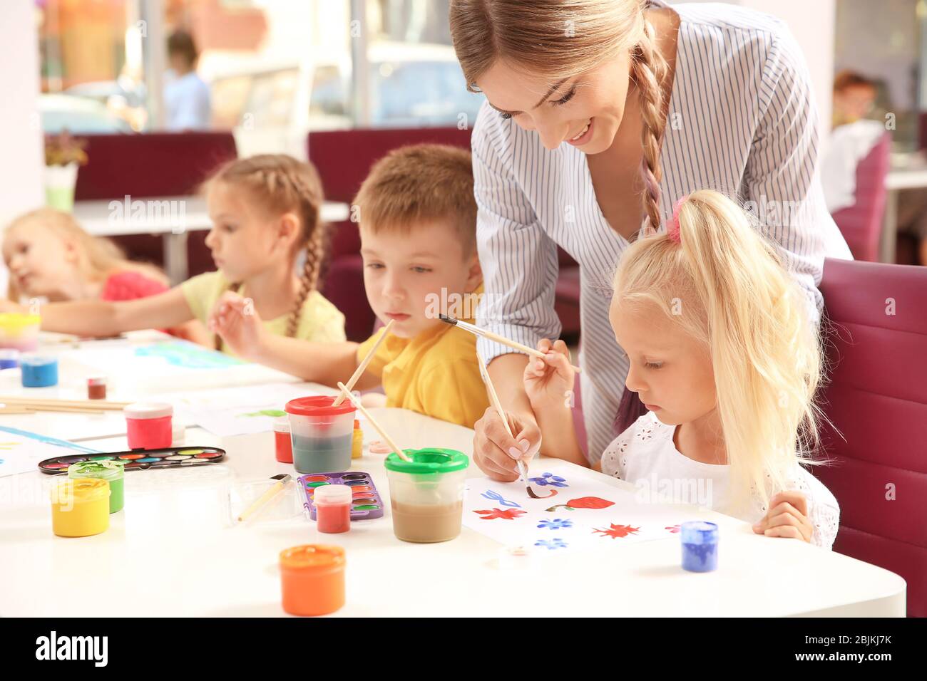 Children at painting lesson in classroom Stock Photo - Alamy